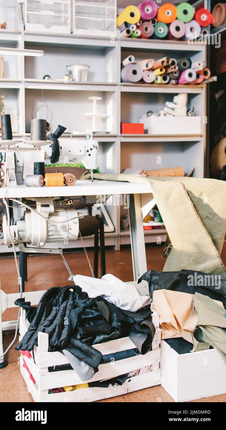 mess tailor studio seamstress workplace cloth roll Stock Photo - Alamy