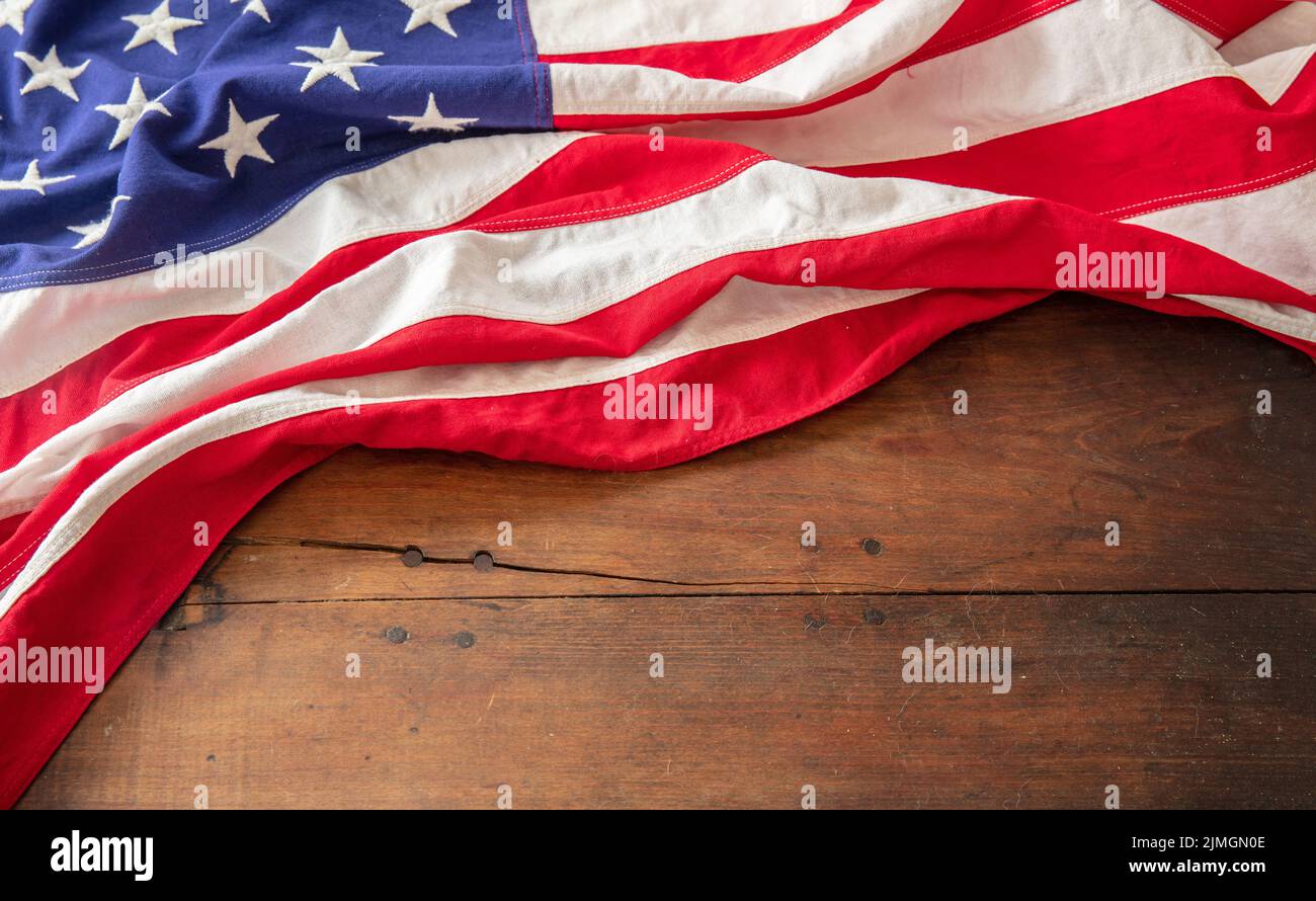 USA Flag on wood, top view. American sign on wooden table, copy space ...