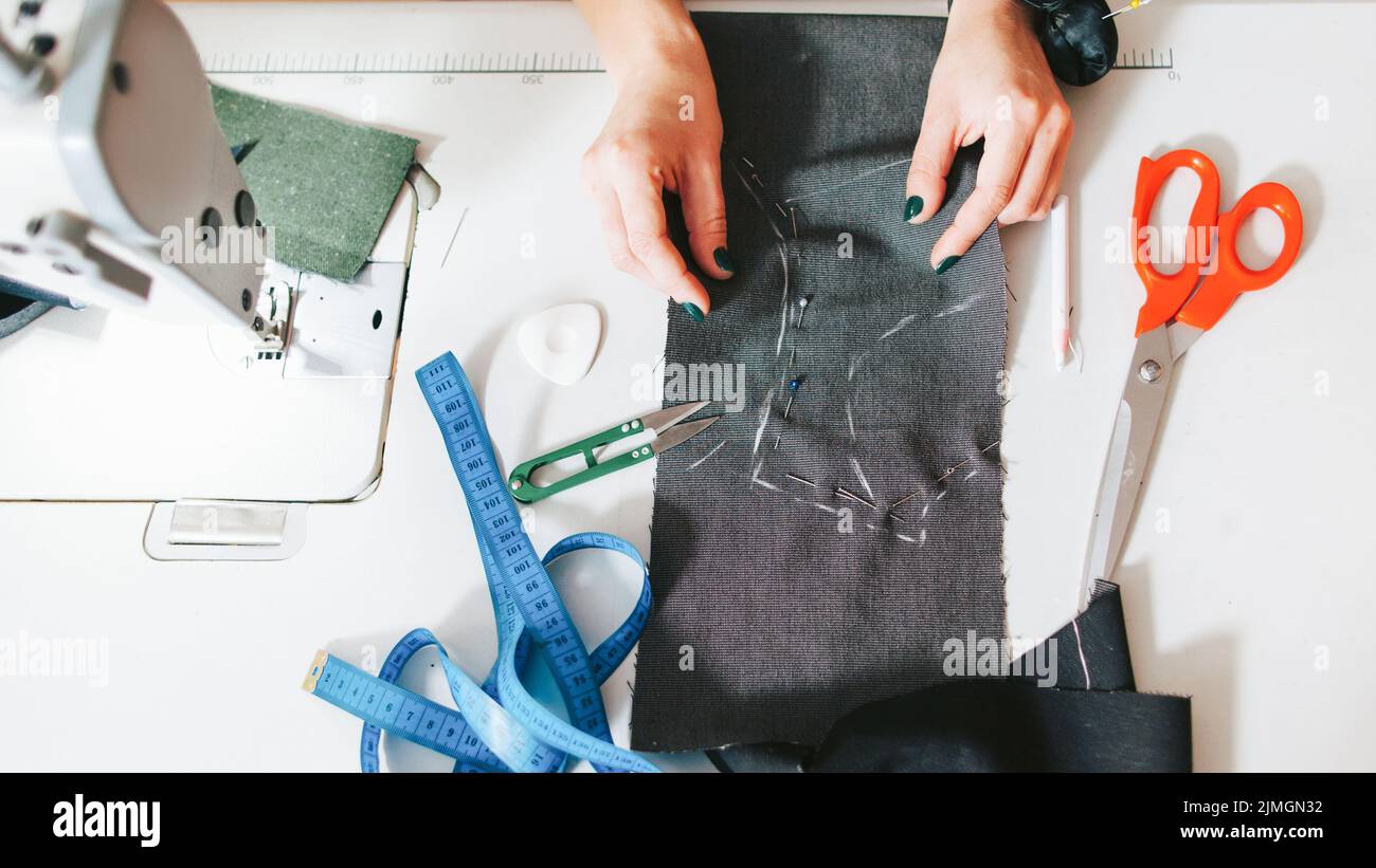 jeans manufacturing seamstress fabric pattern Stock Photo - Alamy