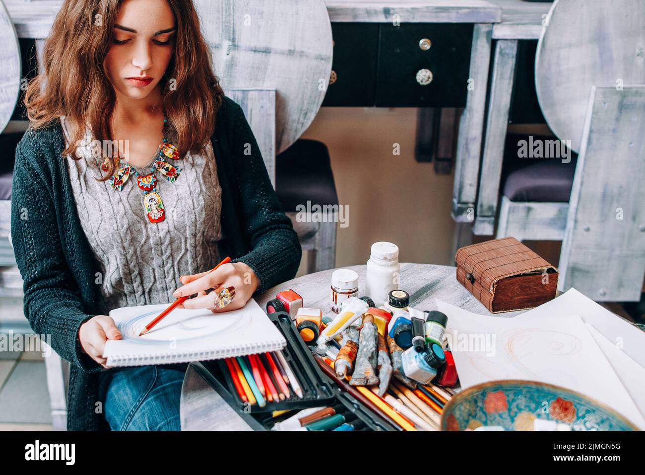 hobby talent lefthanded female artist draw studio Stock Photo - Alamy