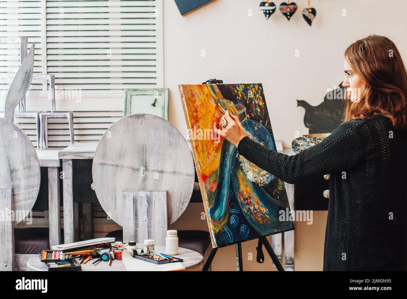 painting process artist creating abstract painting Stock Photo - Alamy