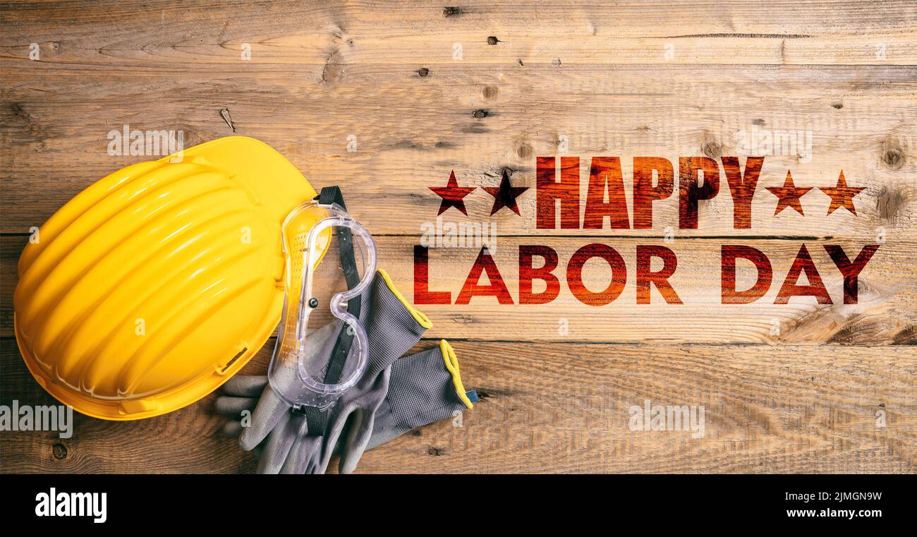 Happy Labor Day text and construction tools on wooden table, top view ...