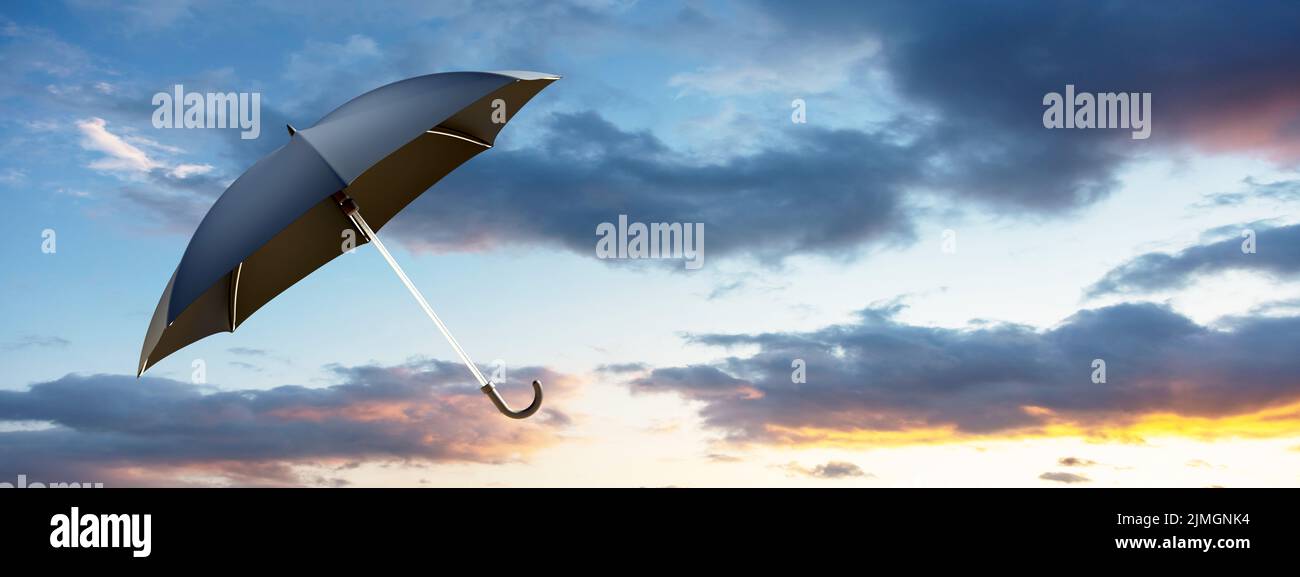 Black color umbrella fly high up with the wind, cloudy sky at sunset ...