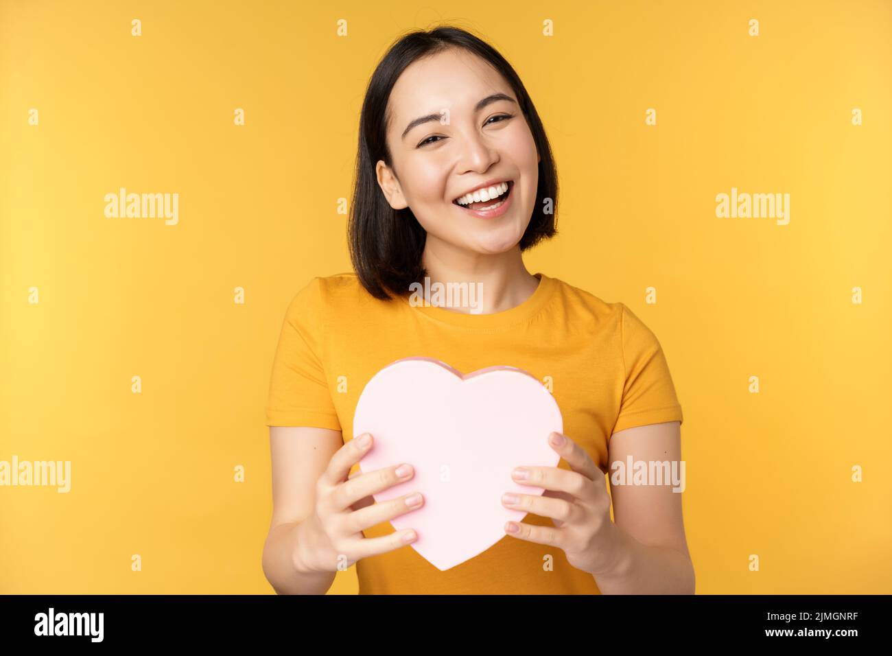Romance and valentines day. Happy beautiful asian woman holding big ...