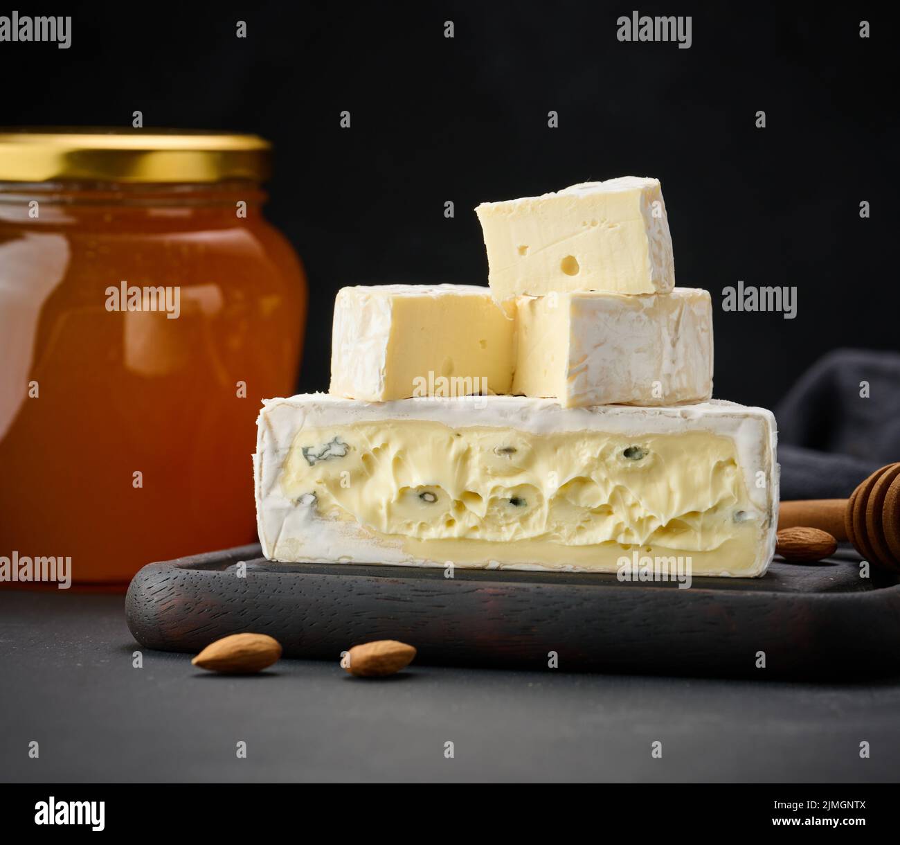 Bergader blue cheese on a brown wooden board, delicious snack Stock ...