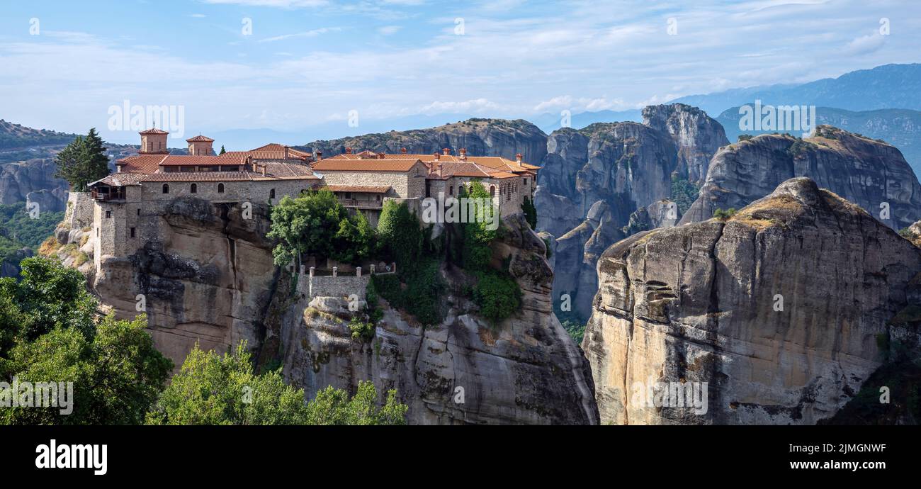 Meteora Greece. Varlaam Holy Monastery buildings on top of rocks, blue ...