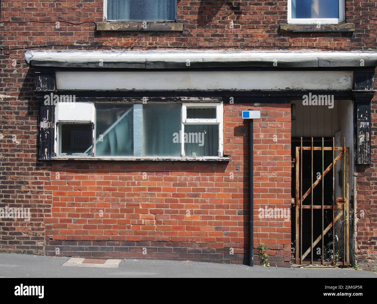 Street view of and empty abandoned business premises converted from a ...