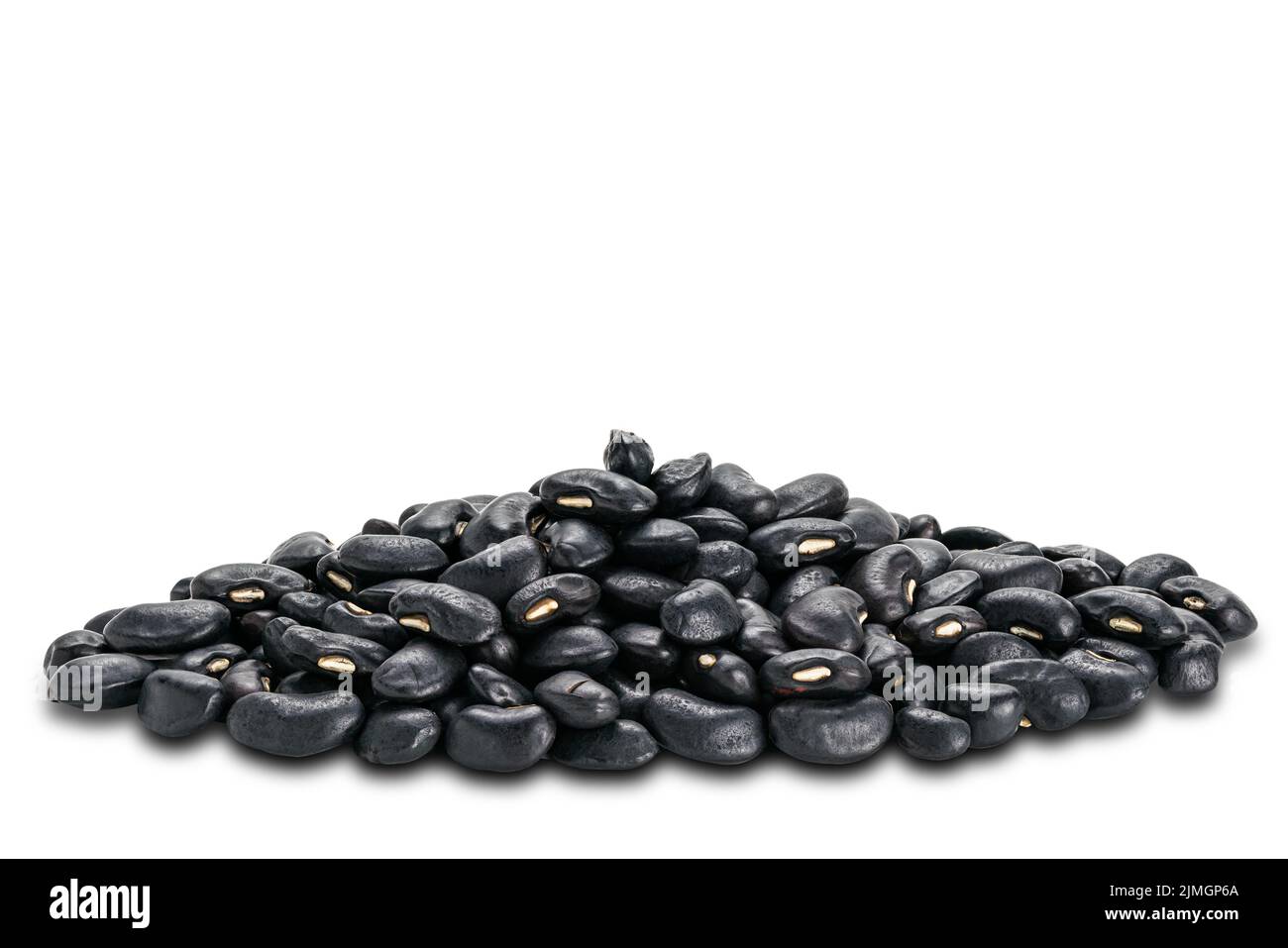 Side view closeup pile of uncooked black beans on white background ...