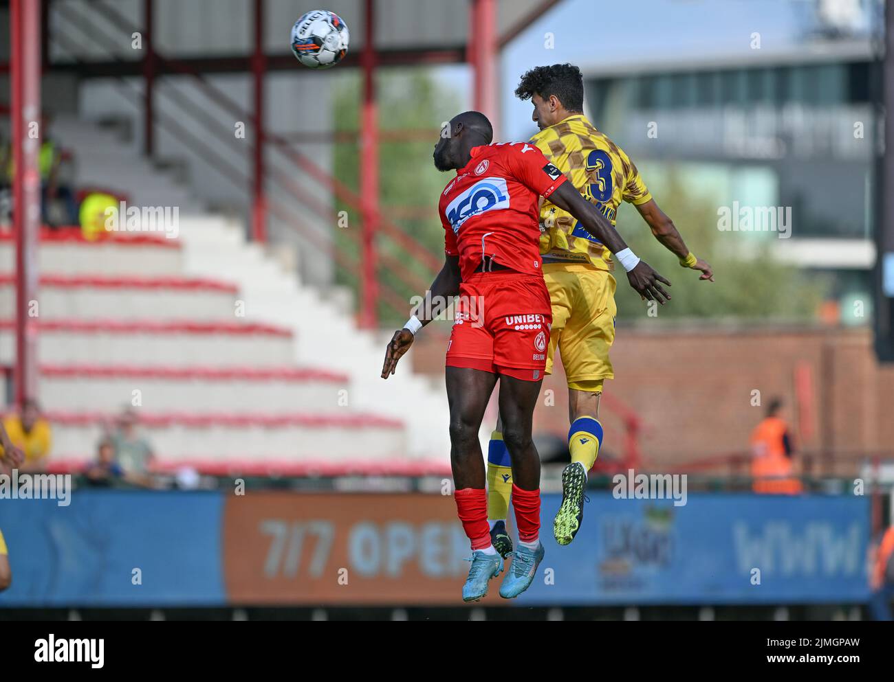 Kortrijk's Pape Habib Gueye and STVV's Ameen Al-Dakhil fight for the ball during a soccer match ...