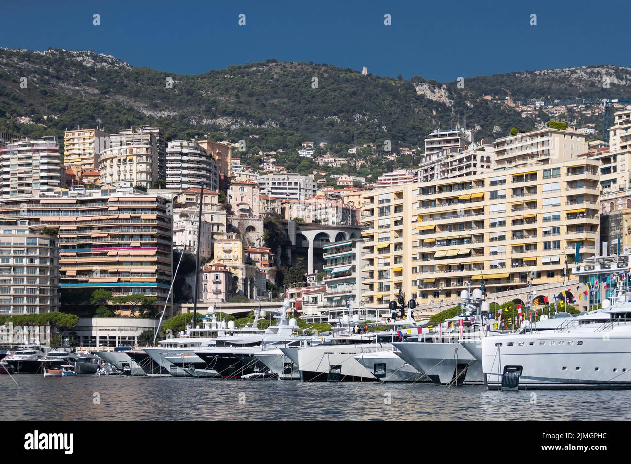 A lot of huge yachts are in port of Monaco at sunny day, megayachts are ...