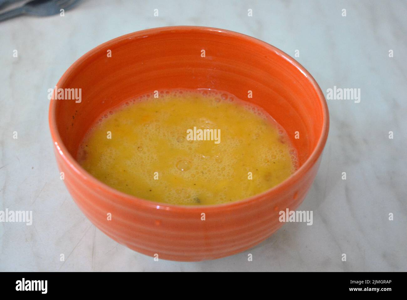 Healthy food, scrambled eggs poured in an orange clay plate Stock Photo ...