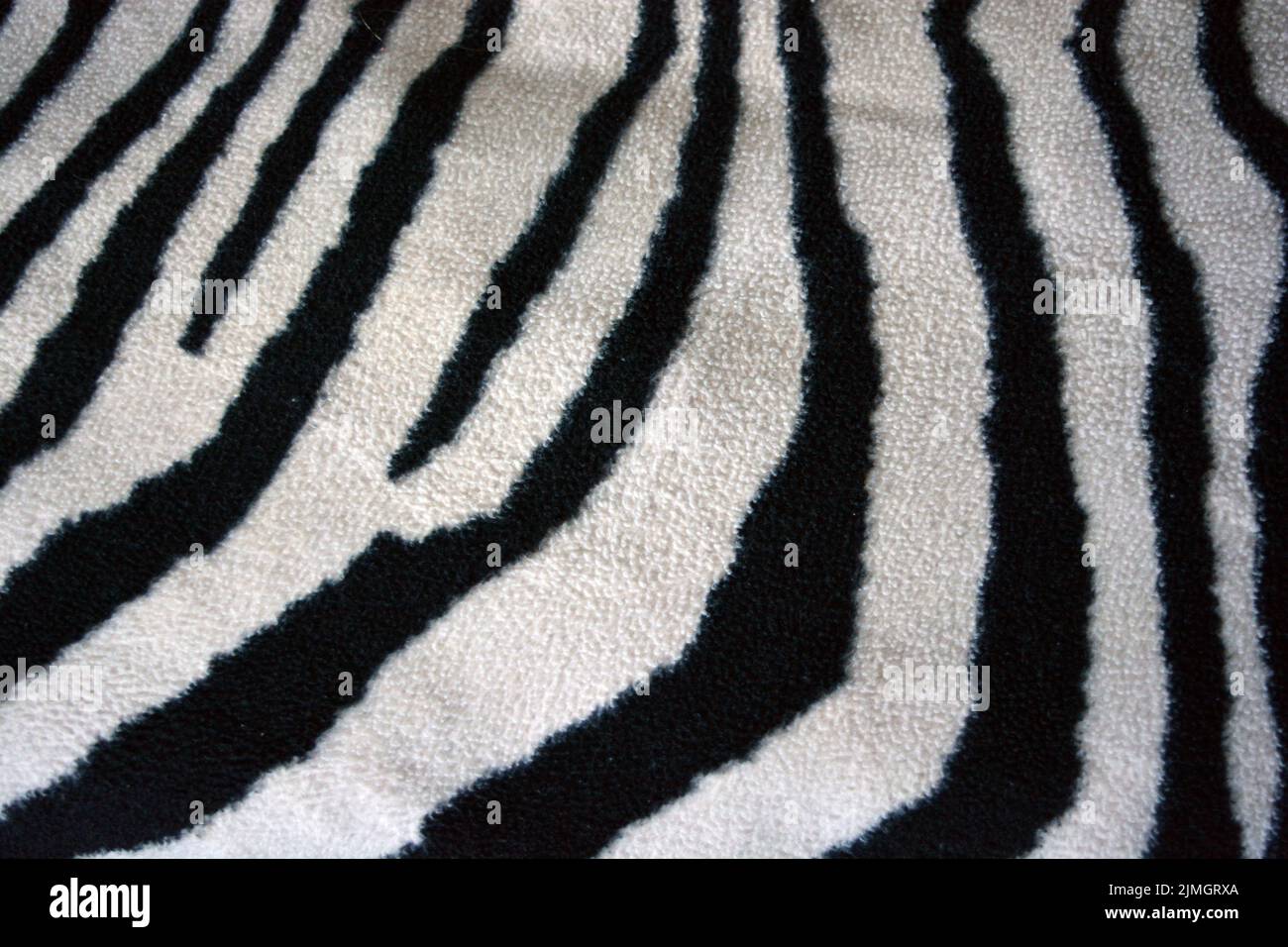 Soft, pleasant, fluffy fabric in the form of zebra, white tiger colors ...