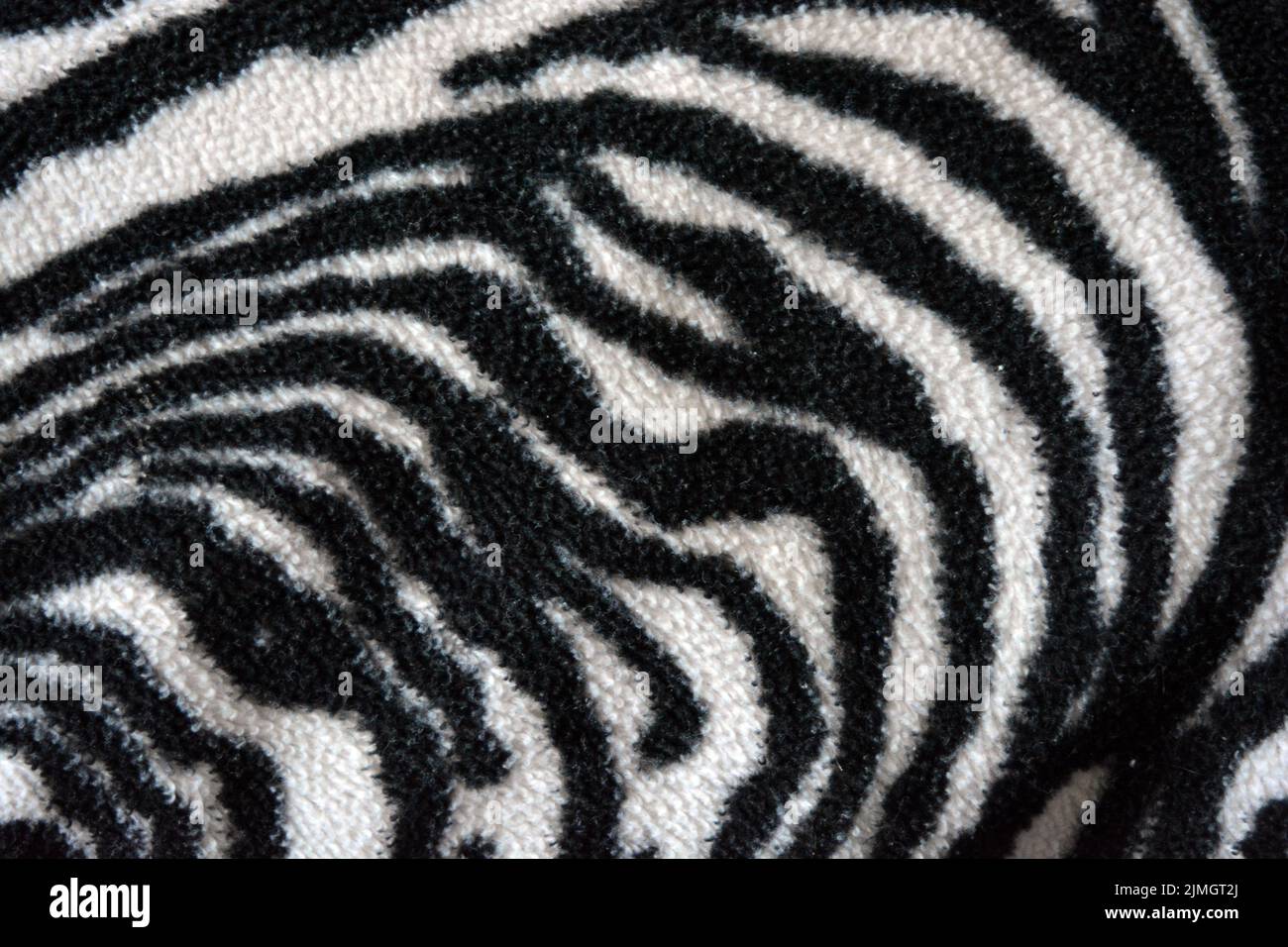 Soft, pleasant, fluffy fabric in the form of zebra, white tiger colors ...