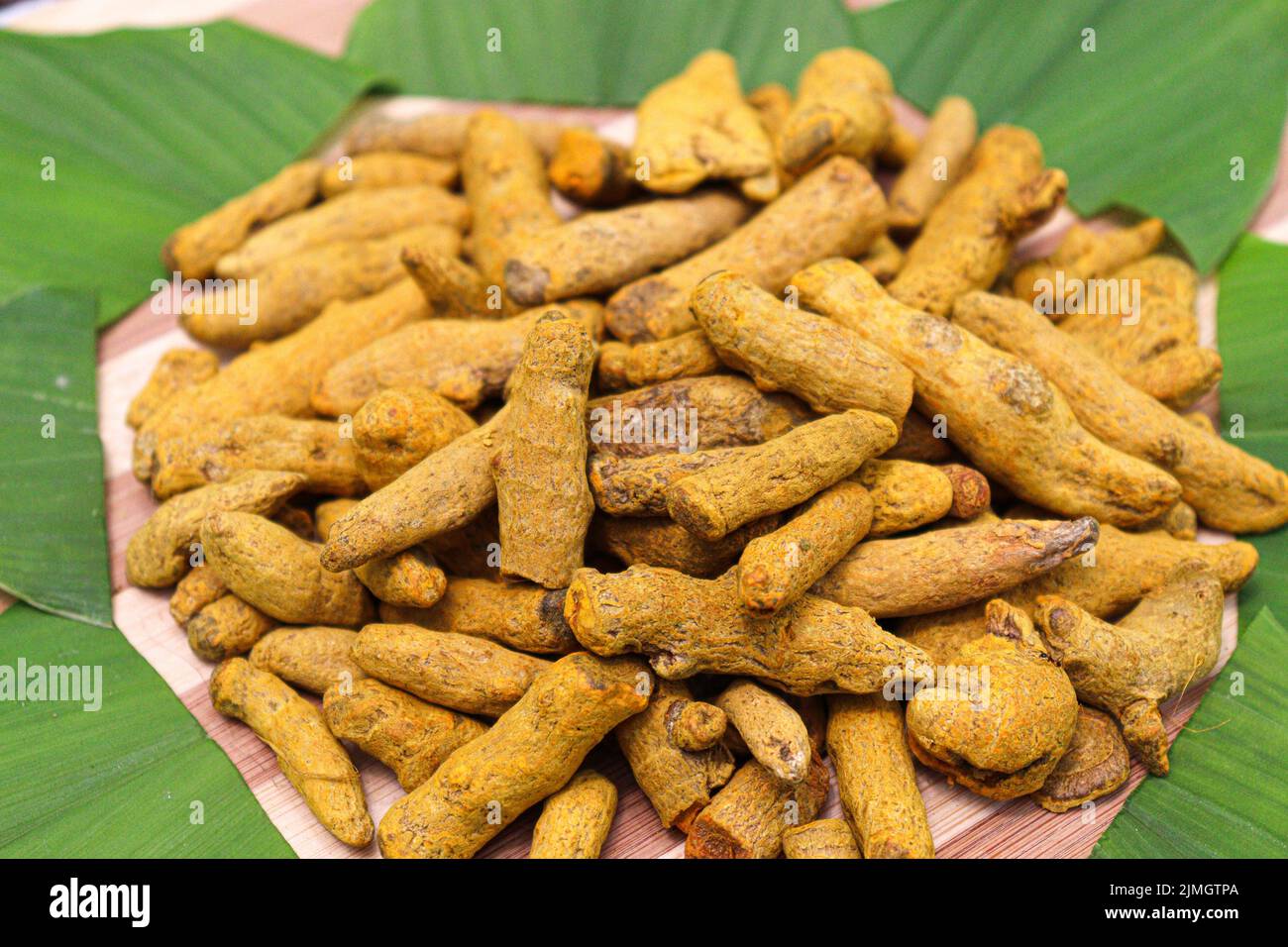 dry turmeric stock with leaf on shop for sell Stock Photo - Alamy