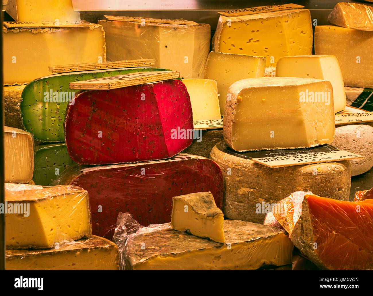 colorful cheeses for sale at the market Stock Photo - Alamy