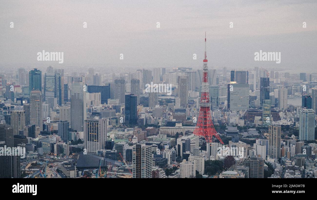 A cityscape of Tokyo city with red Tokyo Tower standing out from the ...