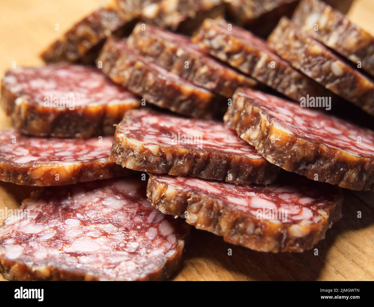 Dried sausage, macrophoto. Lots of sausage slices Stock Photo - Alamy
