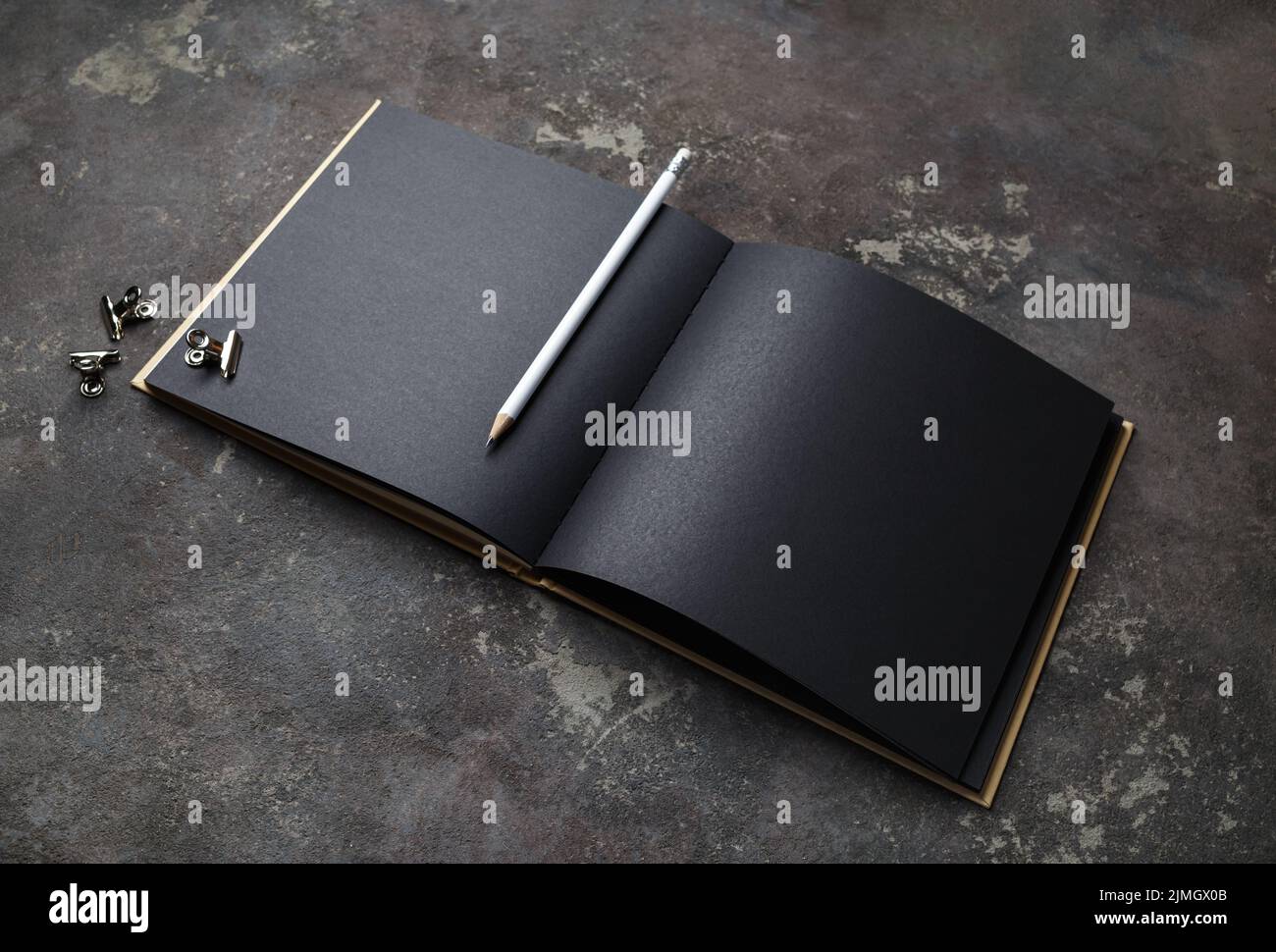 Black book, pencil, eraser Stock Photo - Alamy