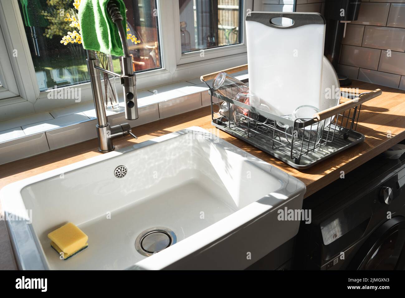 Beautiful white sink belfast style near window in modern kitchen white ...