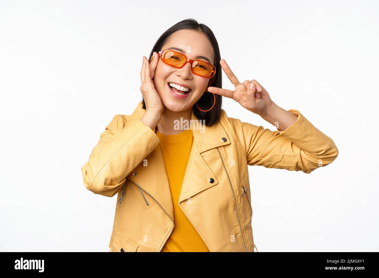 Portrait of stylish asian modern girl, wearing sunglasses and yellow ...