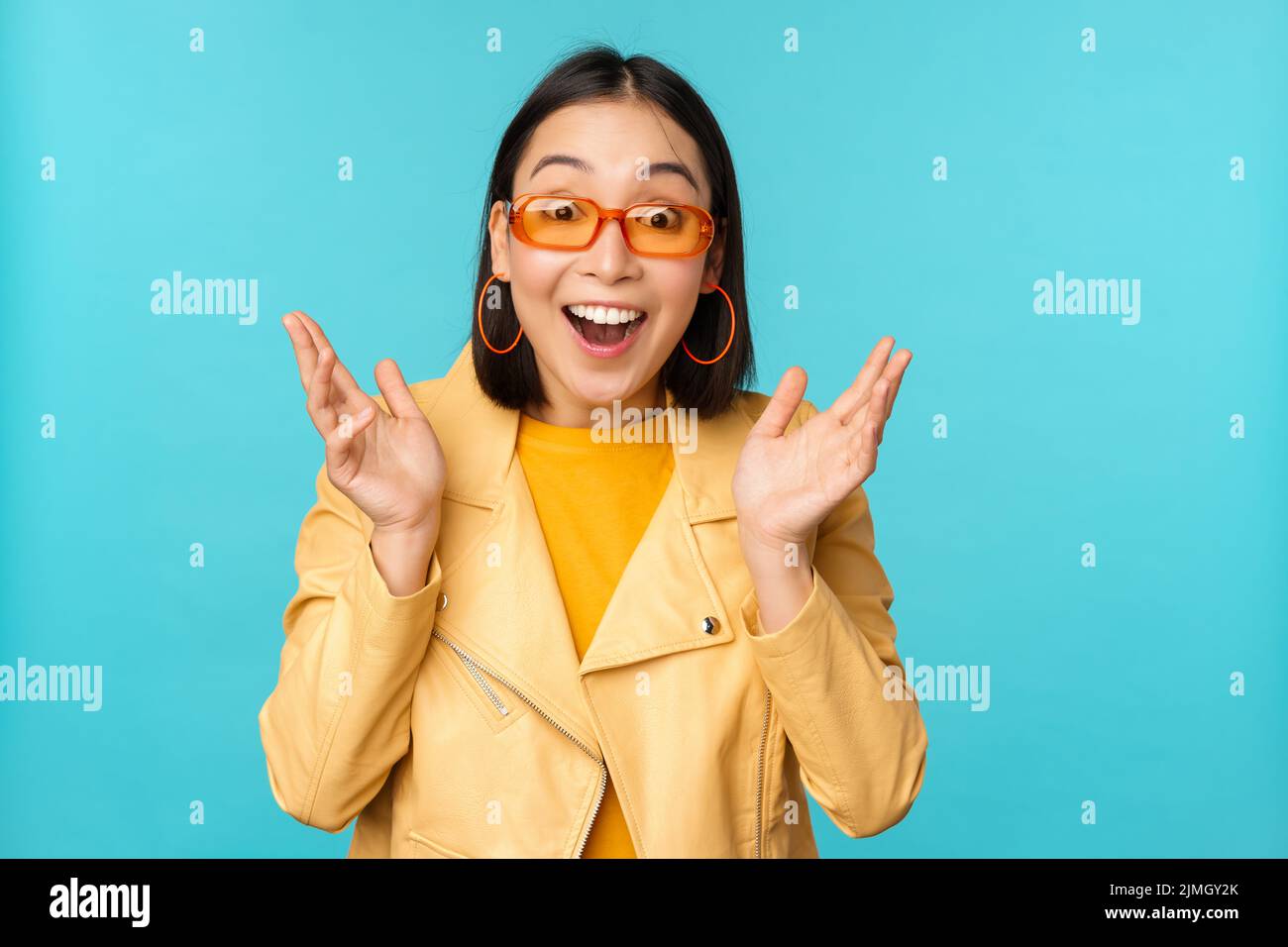 Image of enthusiastic young asian woman celebrating, triumphing ...