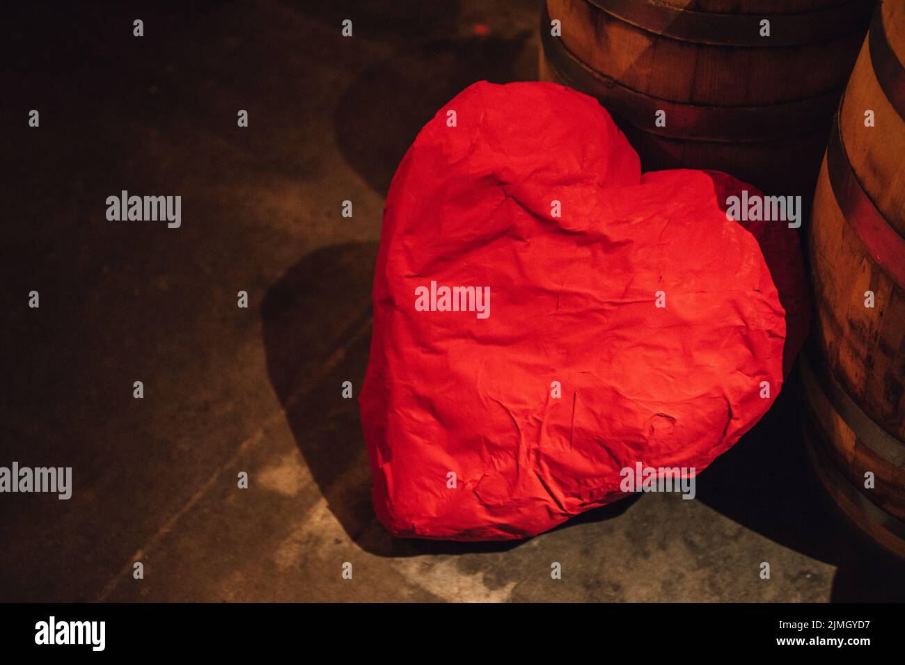 bright red papier mache, paper mache heart on floor Stock Photo - Alamy
