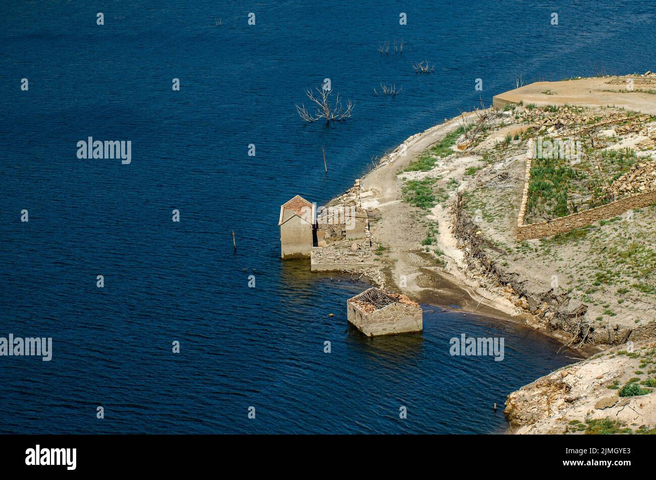 houses in a village flooded by a reservoir that is now drained of water ...