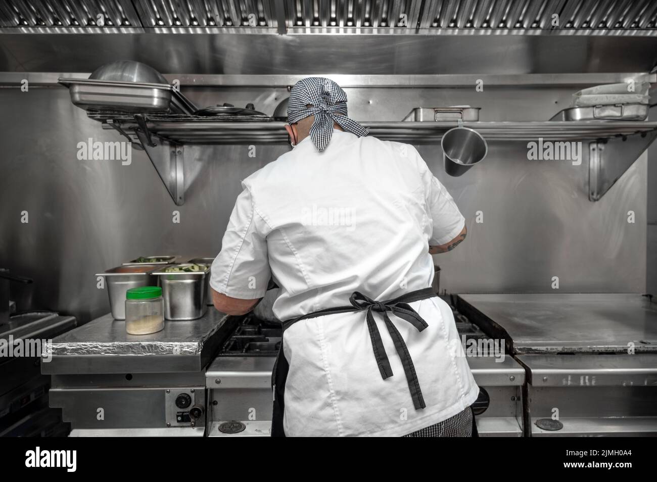 Back view woman cooking in kitchen hi-res stock photography and images ...