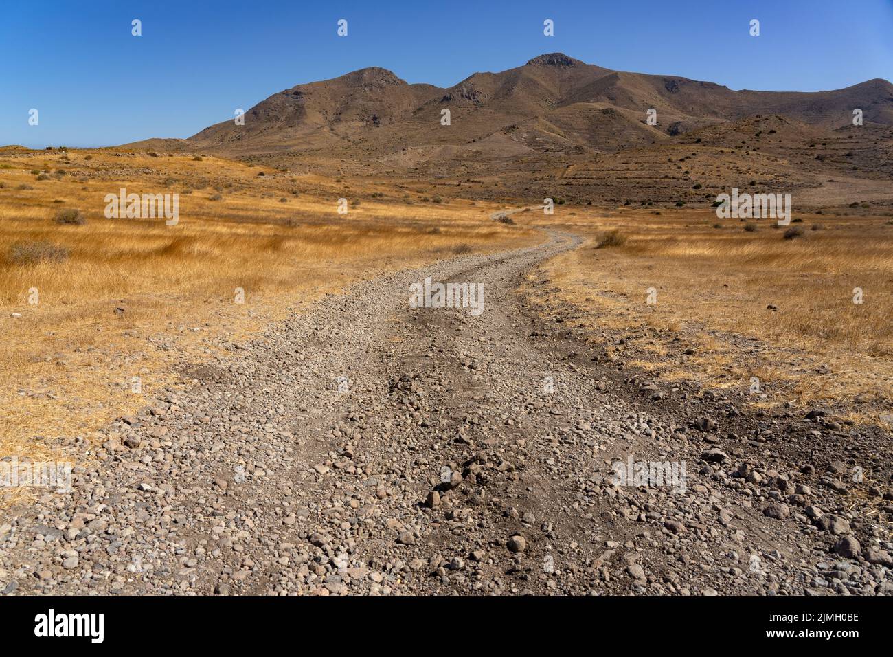 Panoramic view of of mountains with a dirt road in the Gata Cape ...