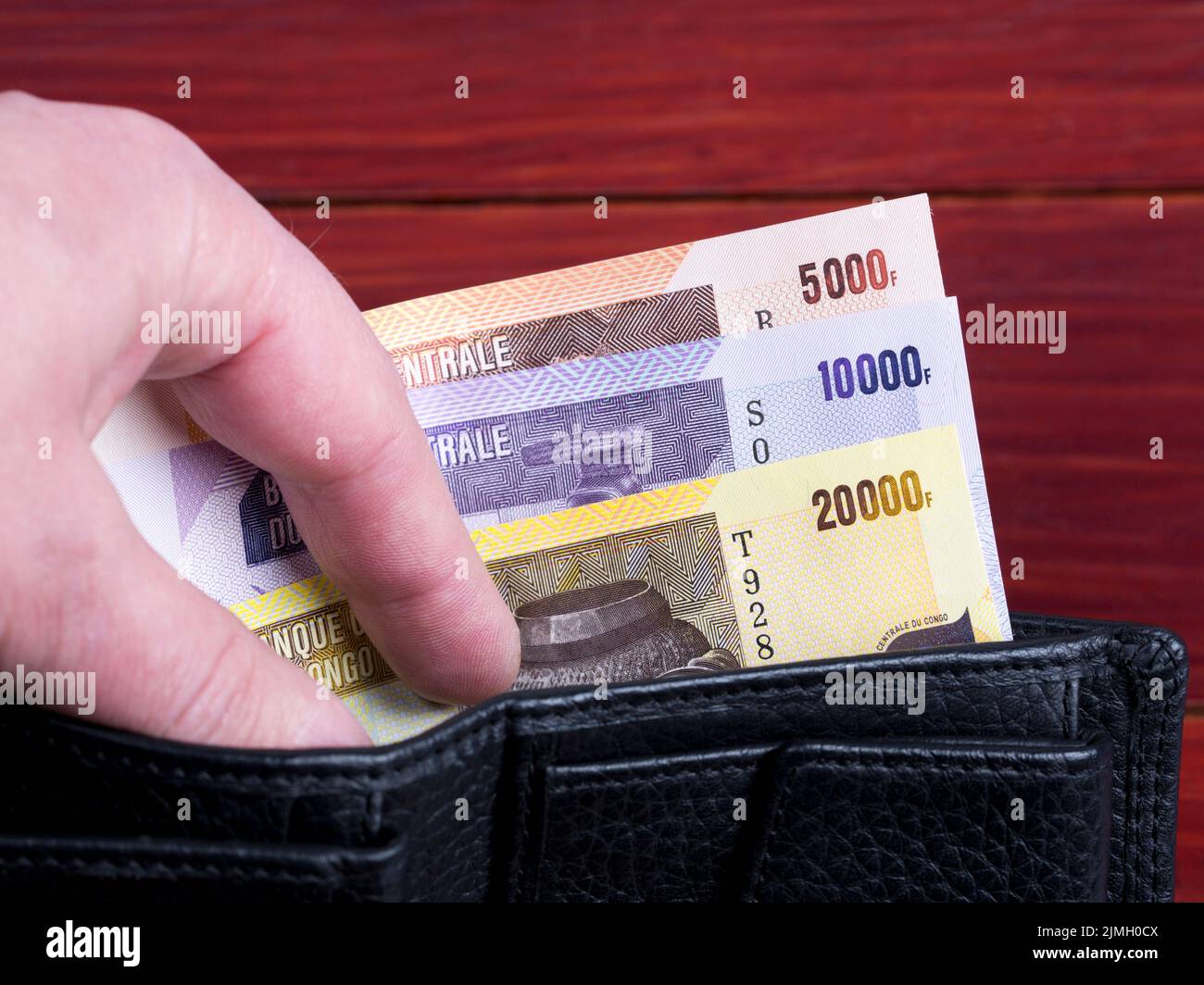 Congolese money - Francs in the black wallet Stock Photo - Alamy