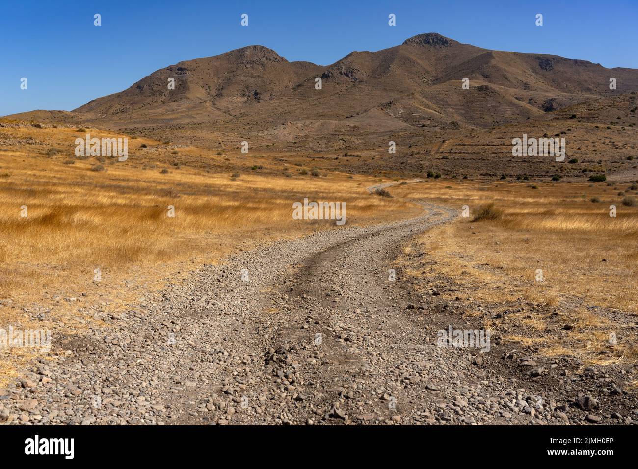 Panoramic view of of mountains with a dirt road in the Gata Cape ...