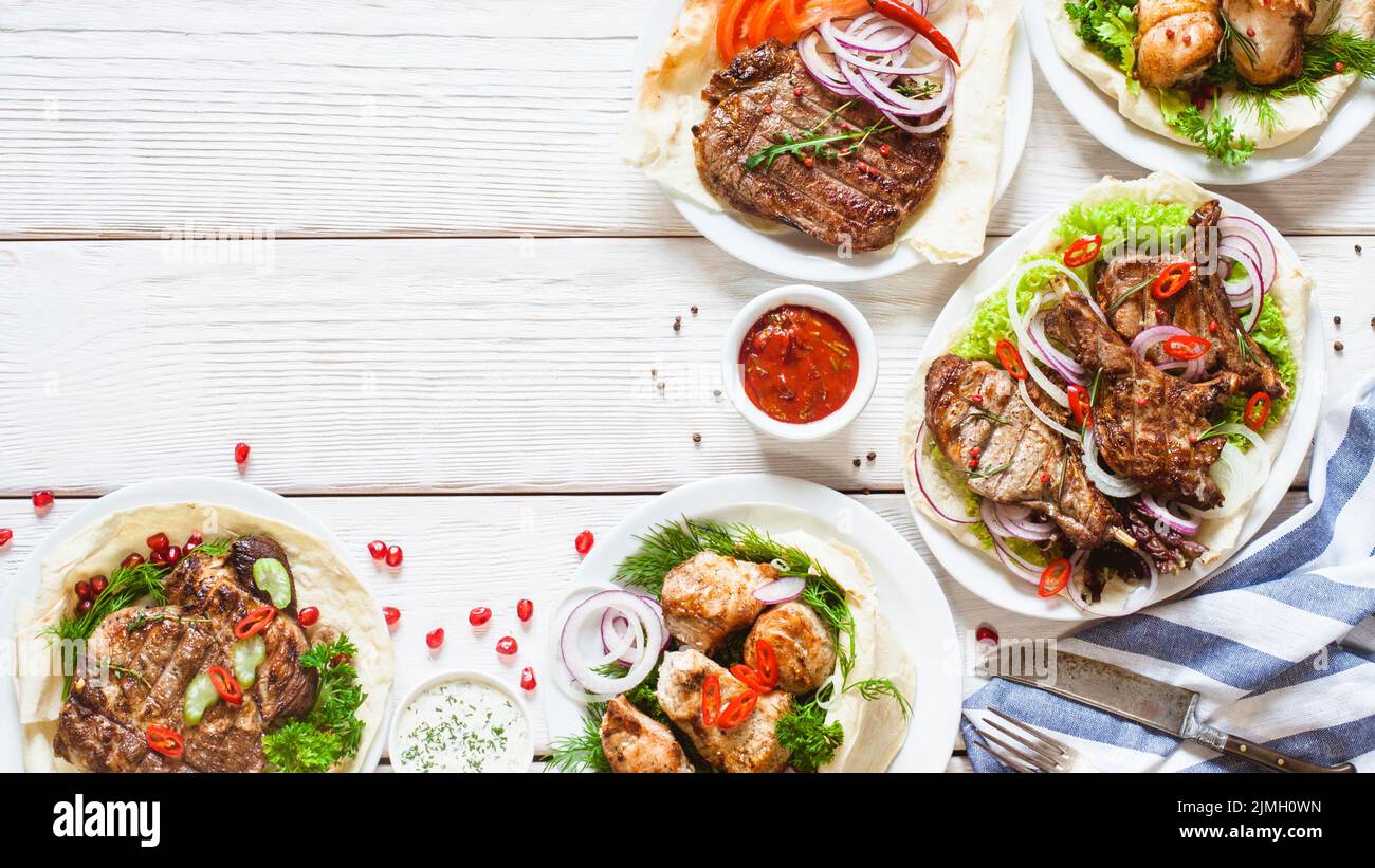 grilled meat meals food table barbecue table dish Stock Photo - Alamy