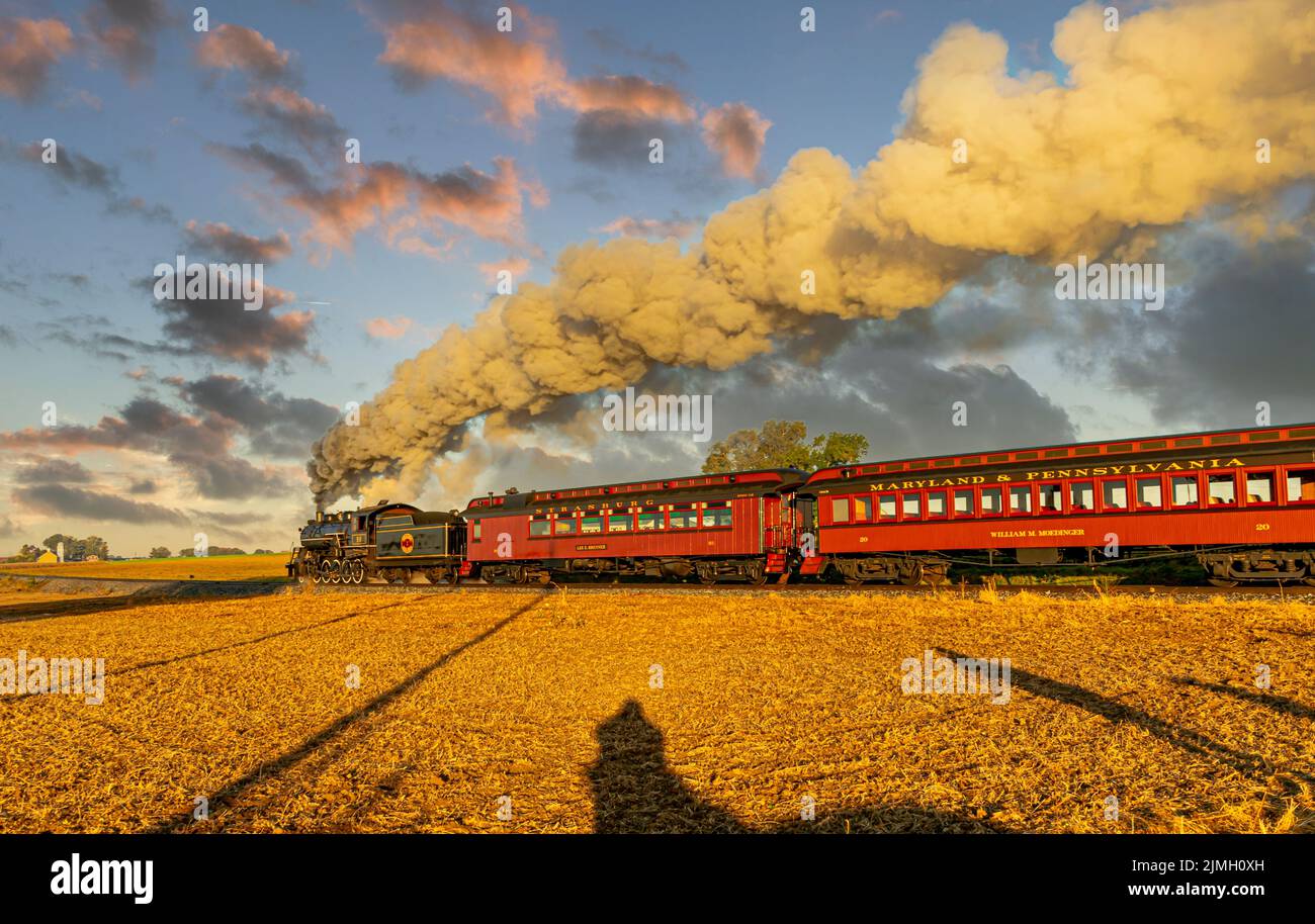 View of an Antique Passenger Steam Train Blowing Smoke Traveling Pass ...