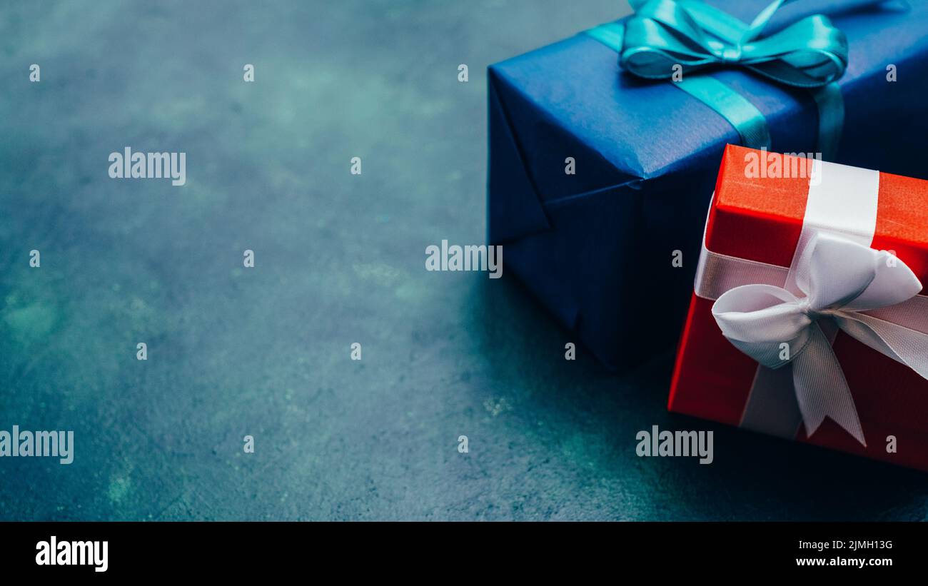 holidays surprise blue red gift boxes background Stock Photo - Alamy