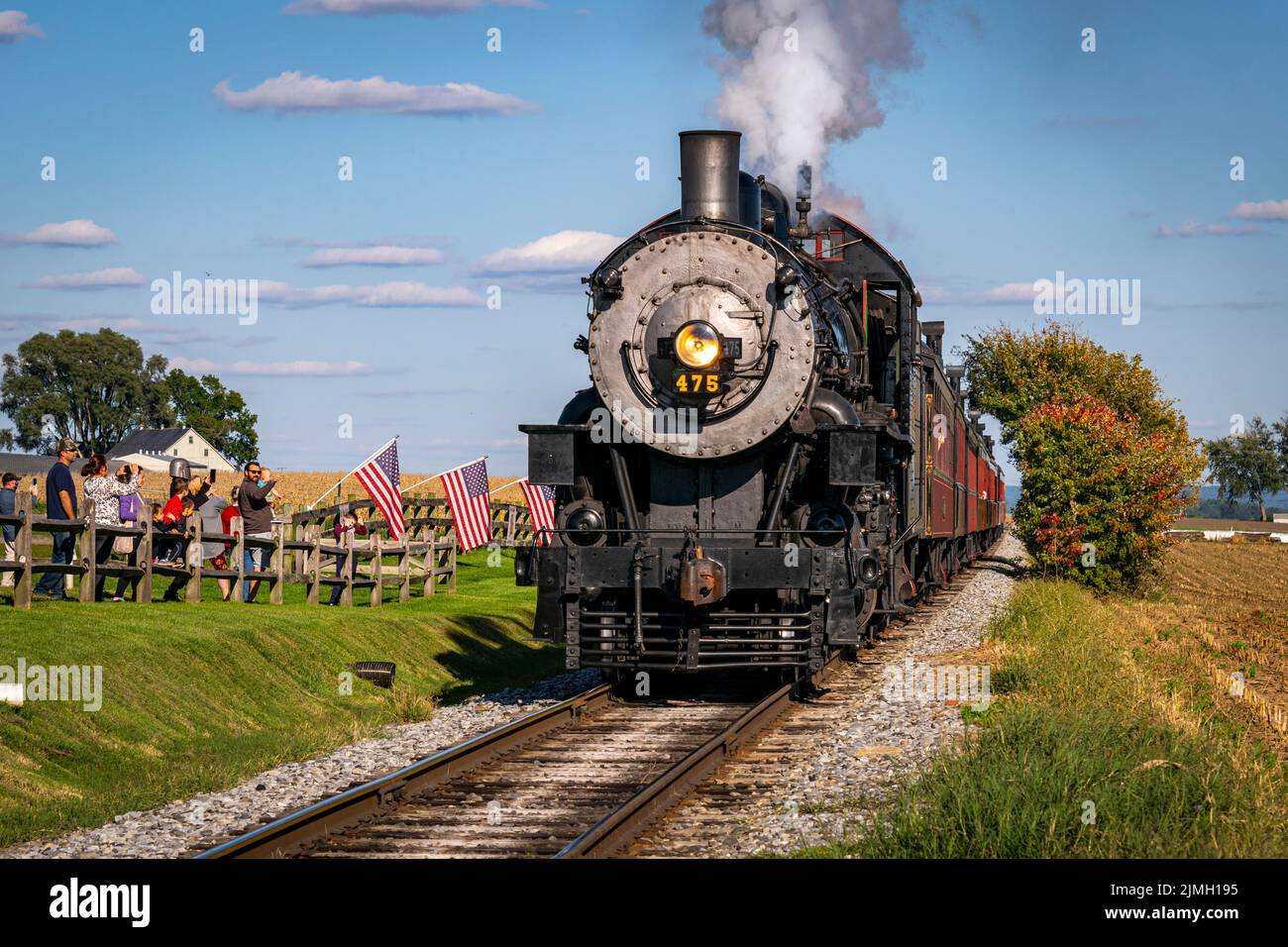 Antique Steam Engine Approach Thru Corn Fields With American Flags ...