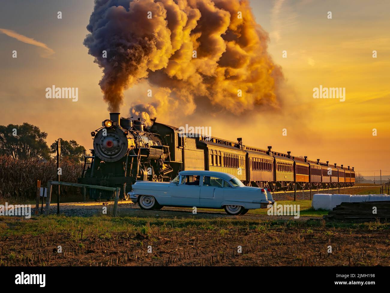 Antique Steam Passenger Train Approaching at Sunrise With a Full Head ...