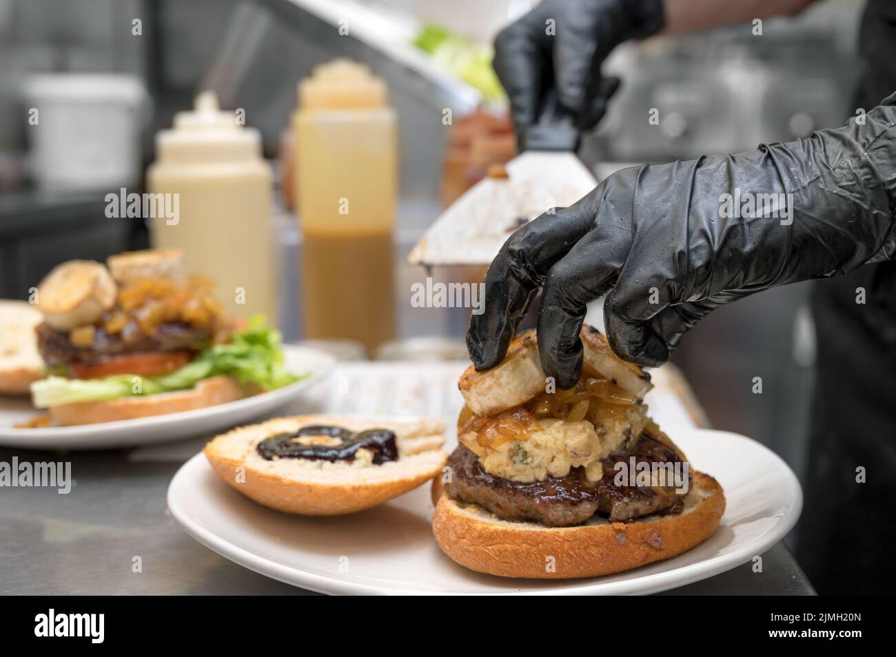 Chef cooking burger,close-up, making sandwich, fast food concept ...
