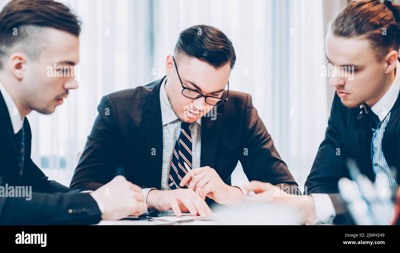 Business partners meeting discussing project hi-res stock photography ...