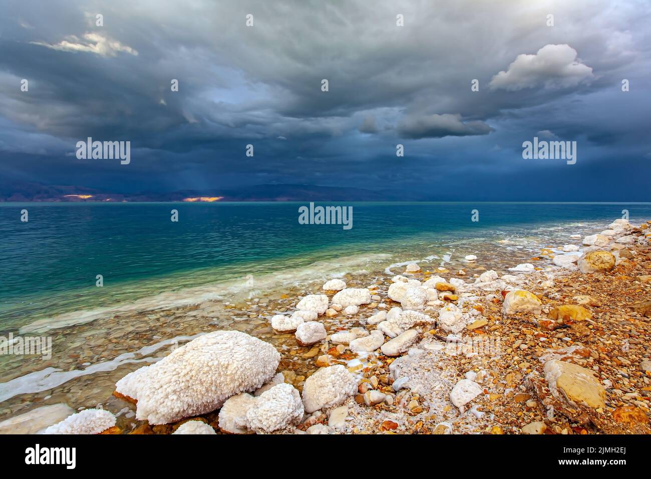 Rocky beach and thunderclouds Stock Photo - Alamy