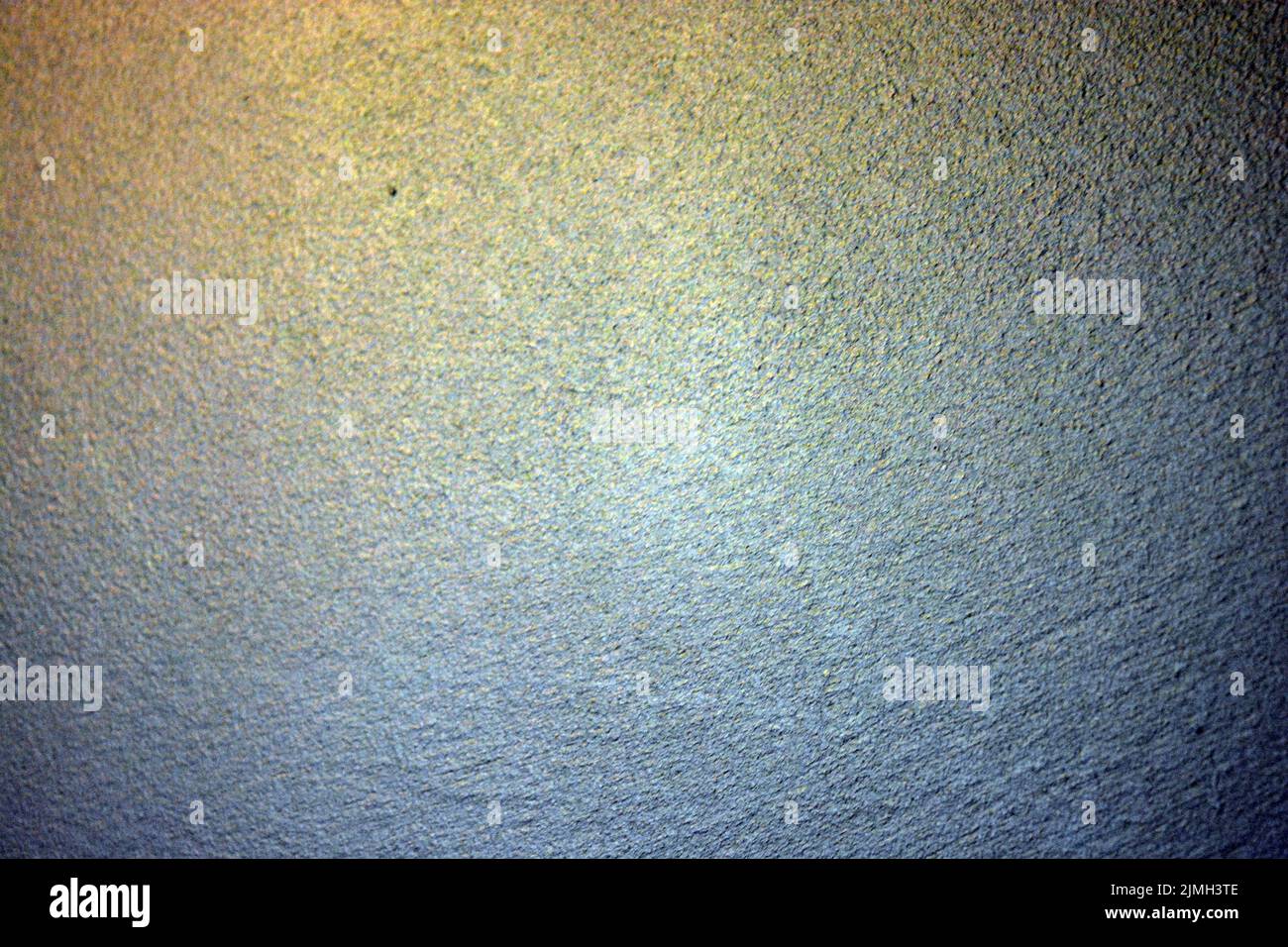 A beautiful structural light gray wall with golden highlights ...