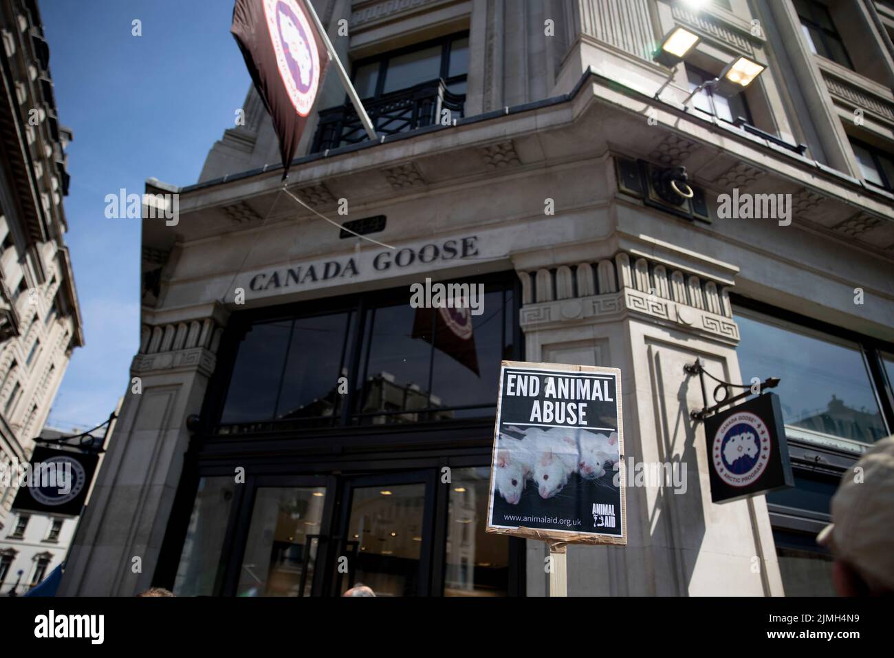 A placard of "End animal abuse" seen in front of the storefront of ...