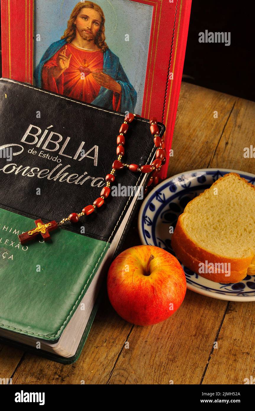 Bible, symbol of the christianism on the table Stock Photo - Alamy