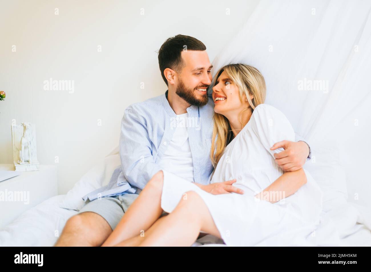 Future mother and father clasped pregnant big tummy. husband hugs ...