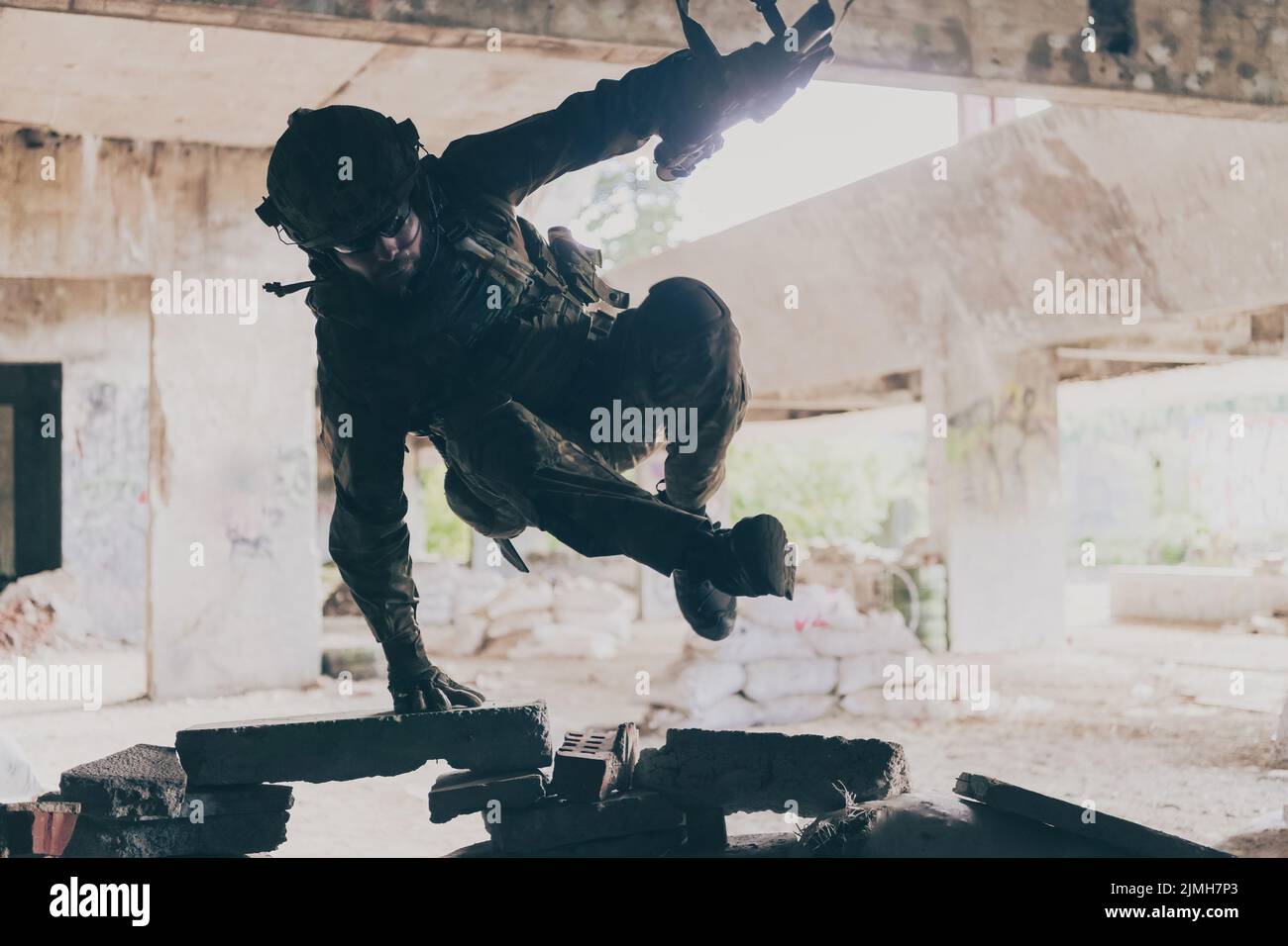 A bearded soldier in uniform of special forces in a dangerous military ...