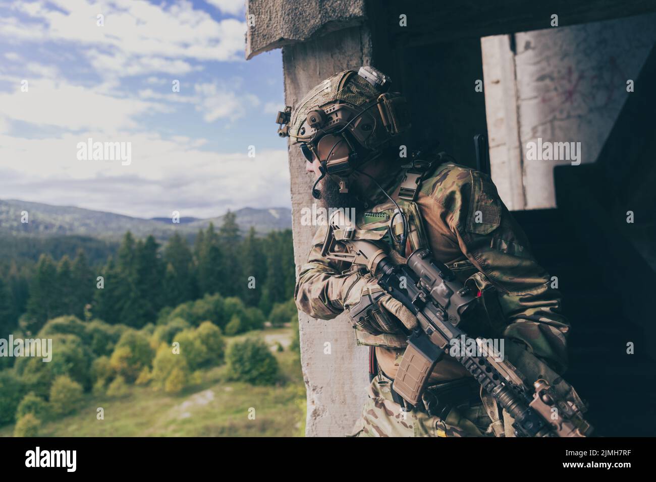 A bearded soldier in uniform of special forces in a dangerous military ...