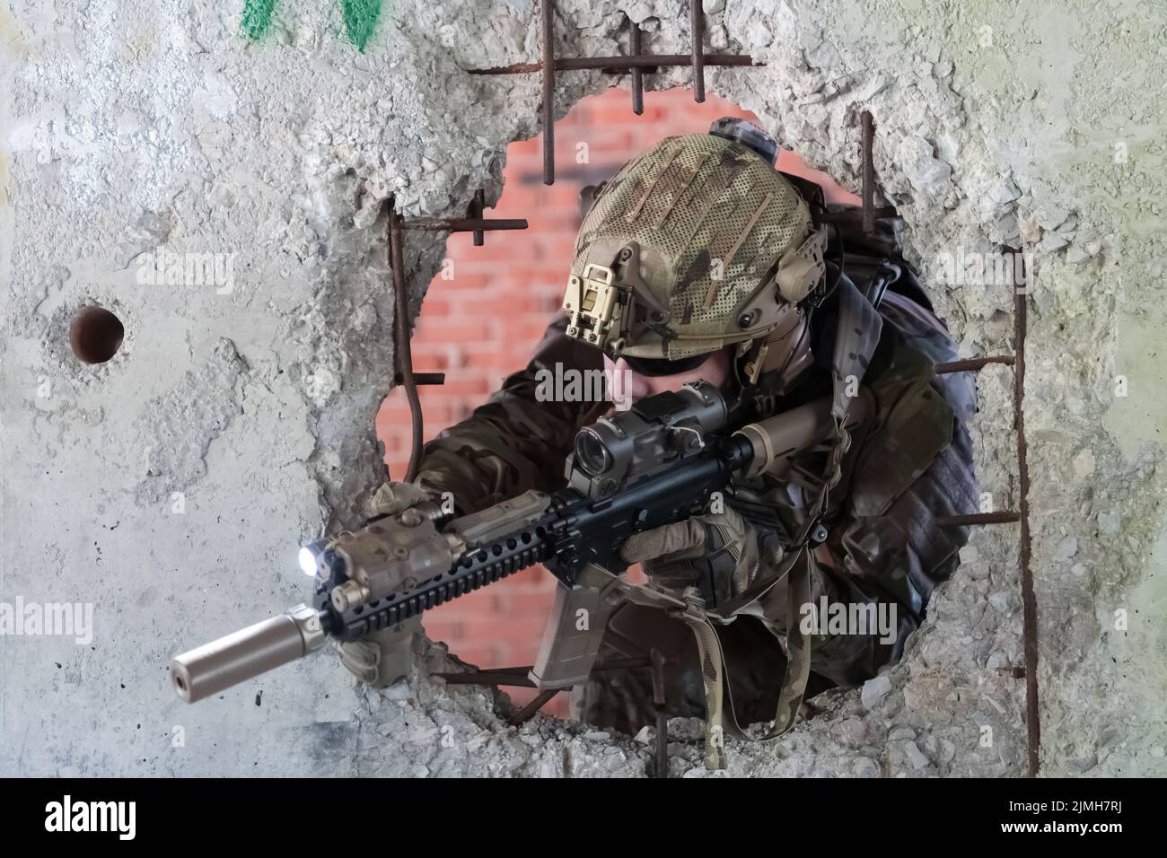 A bearded soldier in uniform of special forces in a dangerous military ...