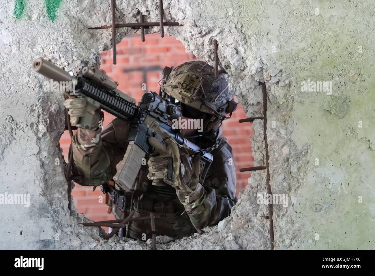 A bearded soldier in uniform of special forces in a dangerous military ...