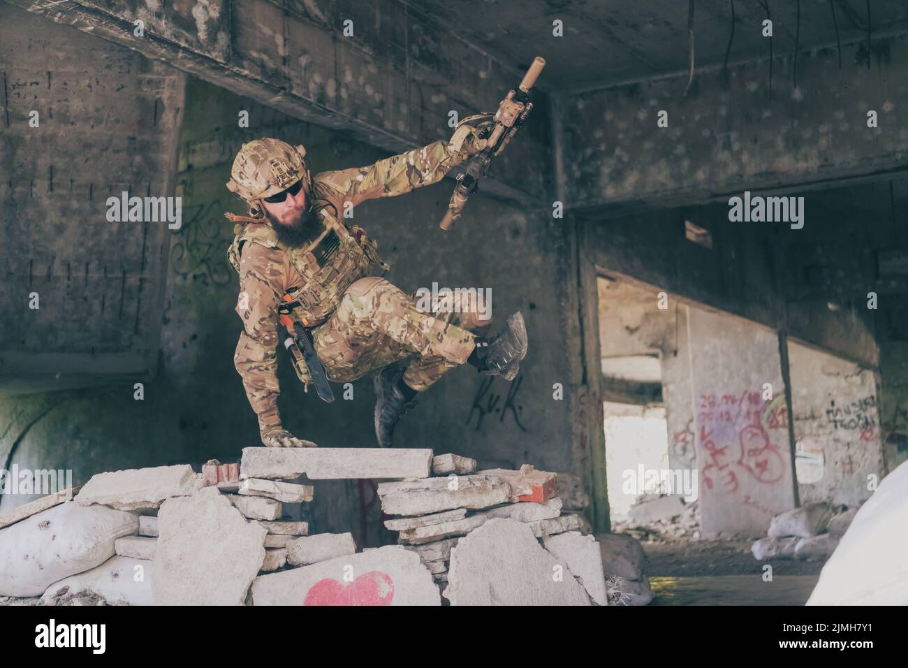 A bearded soldier in uniform of special forces in a dangerous military ...