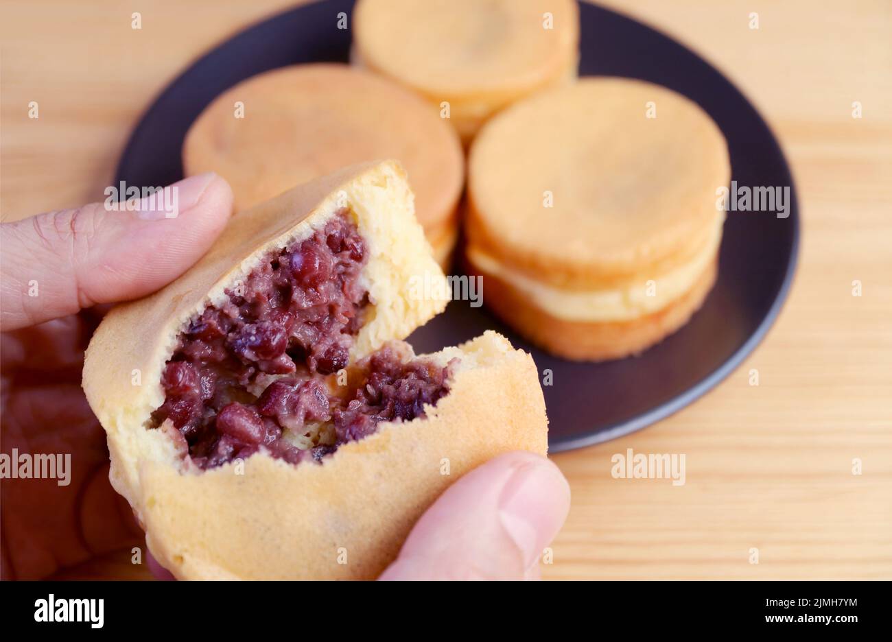 Closeup of Hand Splitting Delectable Japanese Azuki Bean Paste Filled ...