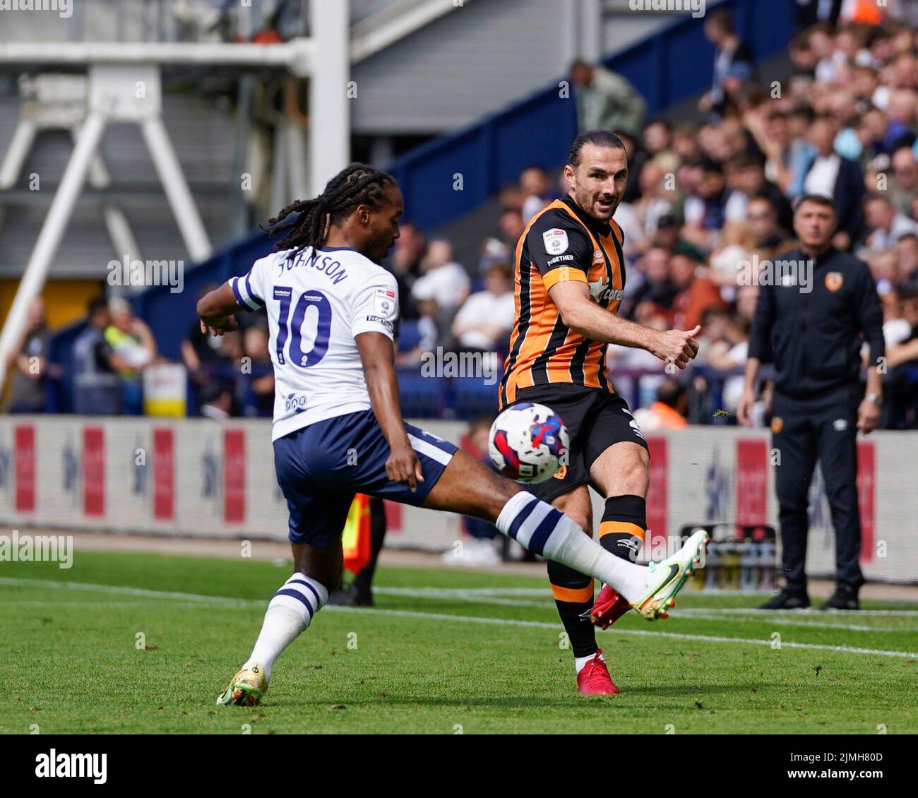 Lewis Coyle #2 of Hull City plays the ball beyond Daniel Johnson #10 of ...